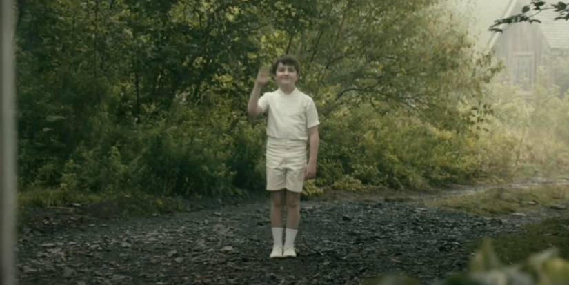 Who Is From’s Boy In White & Is He Actually Helping The Town?