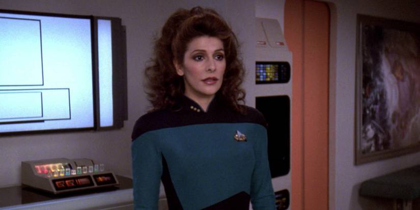 Why Troi Didn’t Wear A Star Trek Uniform Until Later In TNG