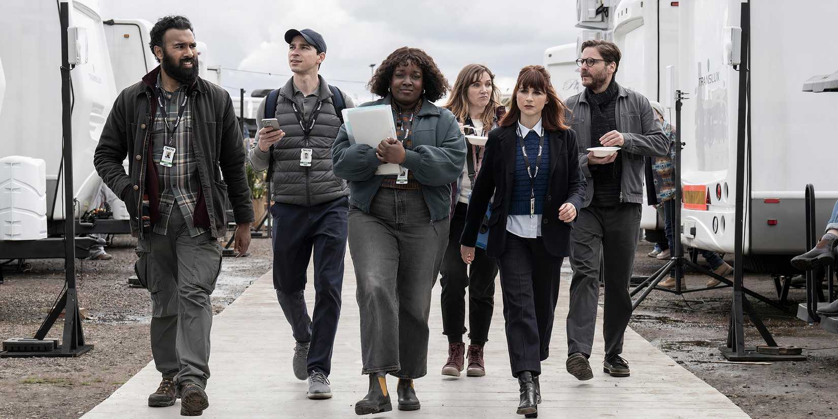 The Franchise Stars Explain How Office Comedy & Superhero Parody Collide