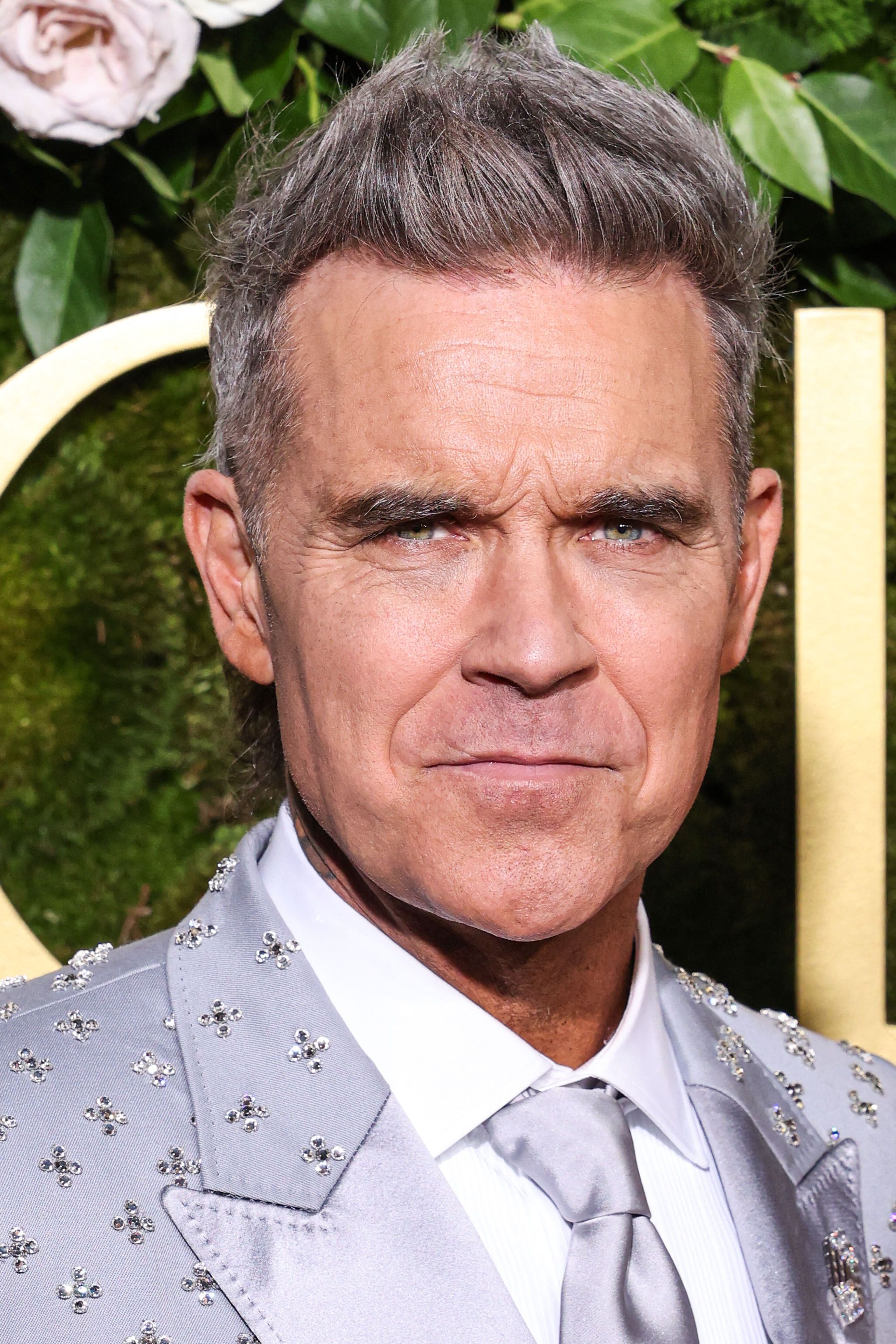 The 10 Biggest Songs Of Robbie Williams' Career